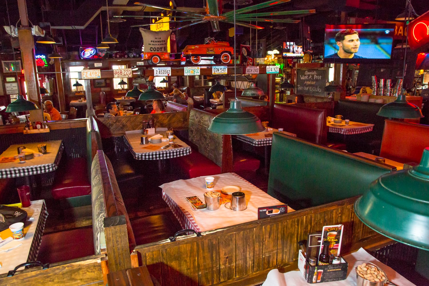 the dining area with buckets of peanuts on each table