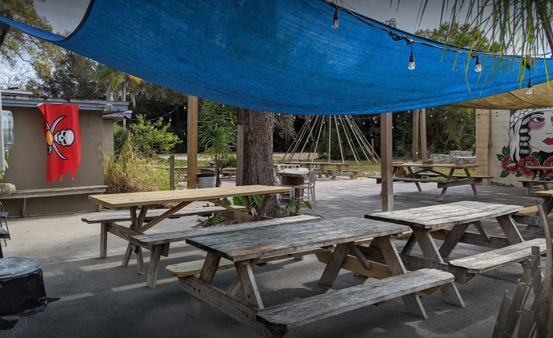 the outdoor dining space of big rays fish camp
