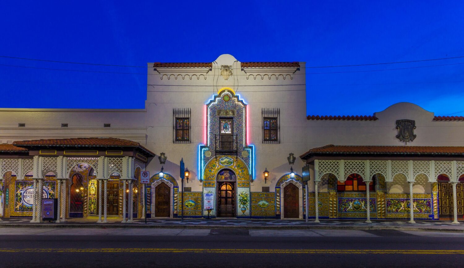the restaurants exterior at night with its glistening decors