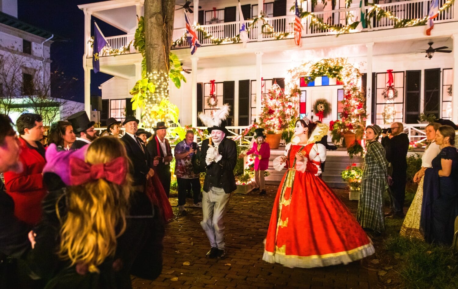 a street perforamance encircled by a huge crowd