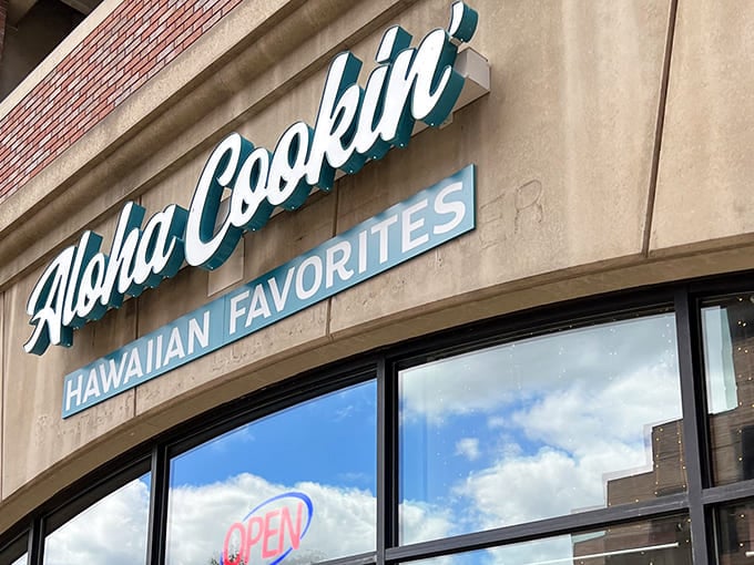 The turquoise sign beckons like a tropical beacon in suburban Michigan, promising island flavors just beyond those doors.