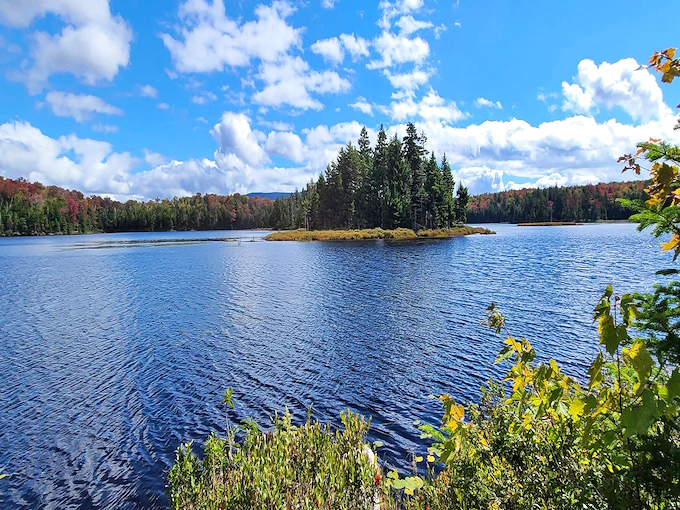 Branch Pond's mirror-like waters reflect Vermont's pristine wilderness, creating a double dose of natural splendor that would make Narnia's creators jealous.