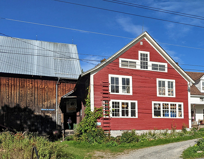 The iconic red farmhouse and weathered barn of Bread & Puppet Theatre stand as Vermont's most delightfully subversive landmark in Glover's rolling countryside.