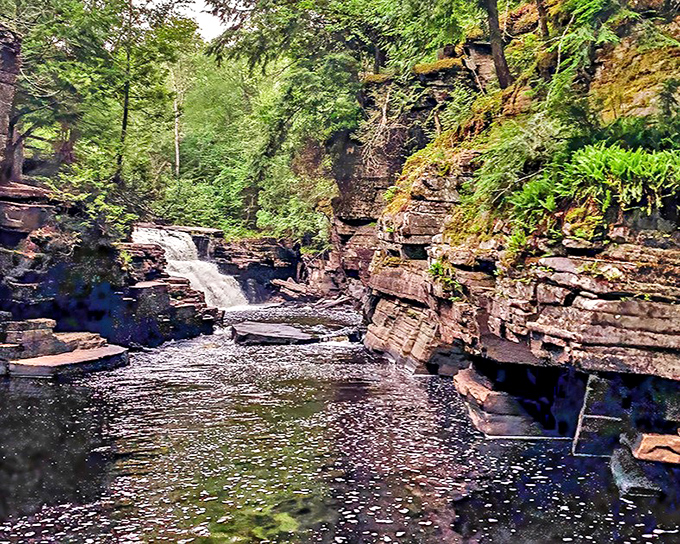 Nature's masterpiece revealed: Canyon Falls carves through ancient bedrock, creating Michigan's own slice of canyon paradise.