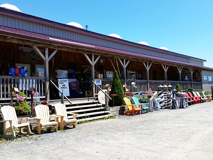 Rustic charm meets practical living at the Community Market's welcoming exterior, where Adirondack chairs invite visitors to slow down and stay awhile.