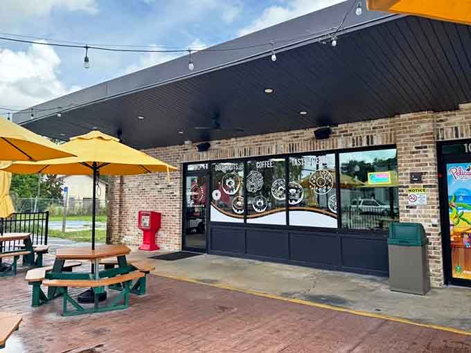 That cheerful yellow patio beckons like a beacon of fried dough happiness, promising sweet refuge from whatever Monday threw at you.