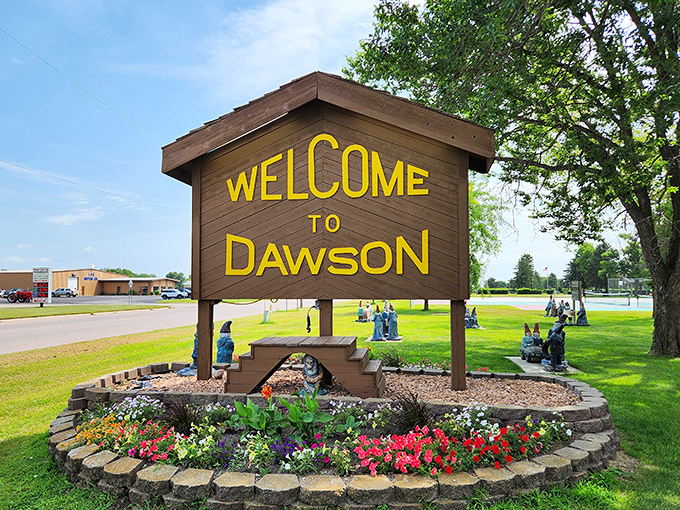 That welcome sign isn't kidding around, those colorful gnomes lining the base mean serious business about their town identity.