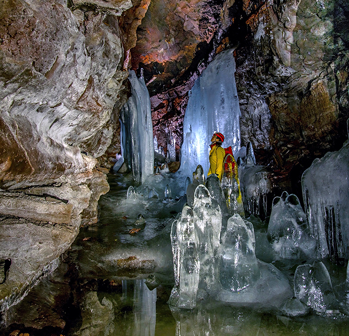 Nature's frozen cathedral: Massive ice formations create an otherworldly landscape inside the main chamber of Debsconeag's underground marvel.