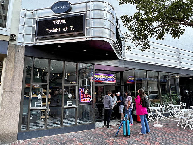 The retro-futuristic fa&ccedil;ade of Arcadia National Bar glows with neon promise, beckoning passersby into a world where nostalgia meets nightlife.