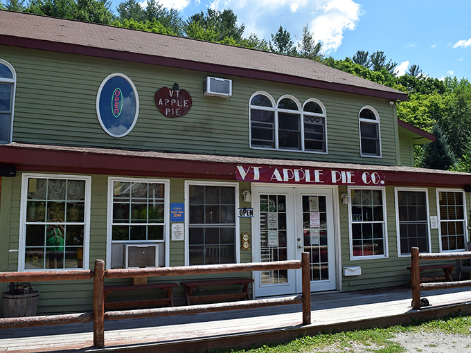 The charming green facade of Vermont Apple Pie Company beckons like a beacon of buttery hope amid Vermont's picturesque landscape.