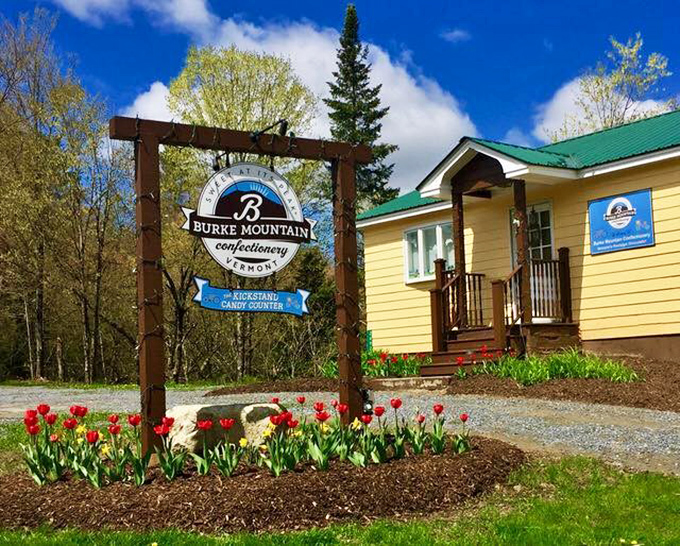 Welcome to chocolate paradise! The charming yellow farmhouse of Burke Mountain Confectionery stands proudly against Vermont's blue skies, promising sweet adventures within.
