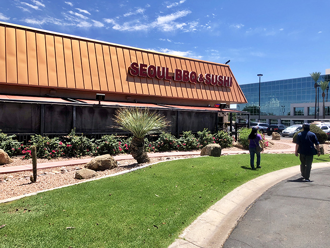 The copper-toned exterior of Seoul BBQ & Sushi stands out against Arizona's blue sky, promising culinary adventures within its walls.