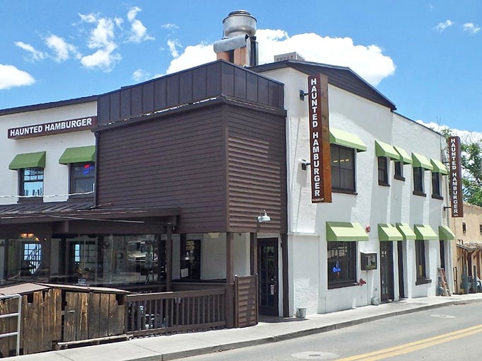 The Haunted Hamburger's distinctive exterior beckons hungry travelers with its skeleton-adorned facade and promise of supernatural delights in historic Jerome.