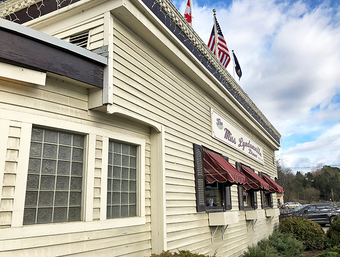 Classic diner architecture meets Vermont charm in this cream-and-burgundy beauty that looks like it time-traveled from the golden age of American roadside dining.