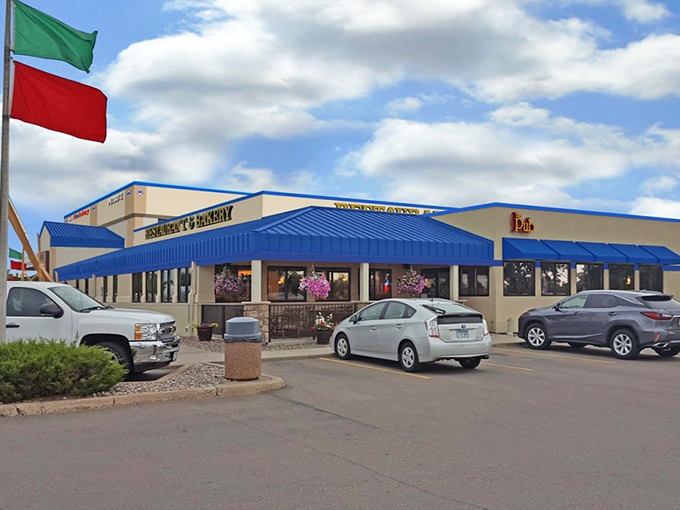 That blue awning marks the spot where gas station expectations go to die, in the best possible way.