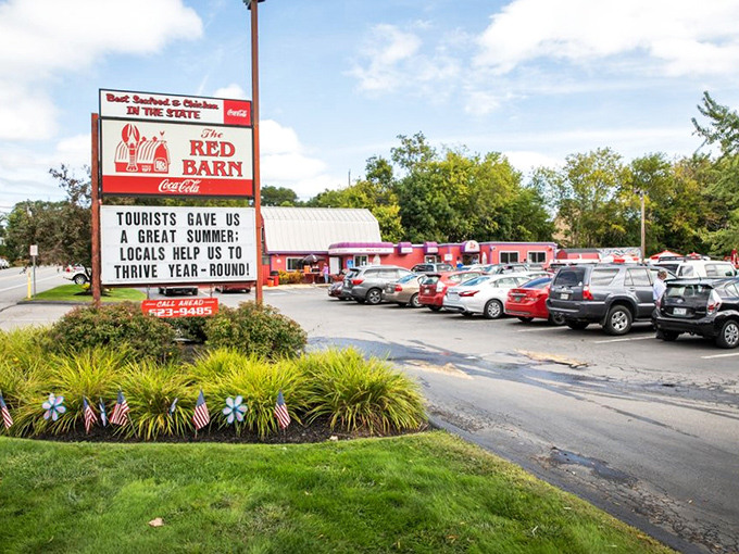 The iconic Red Barn sign welcomes hungry visitors with its promise of seafood excellence and community wisdom.