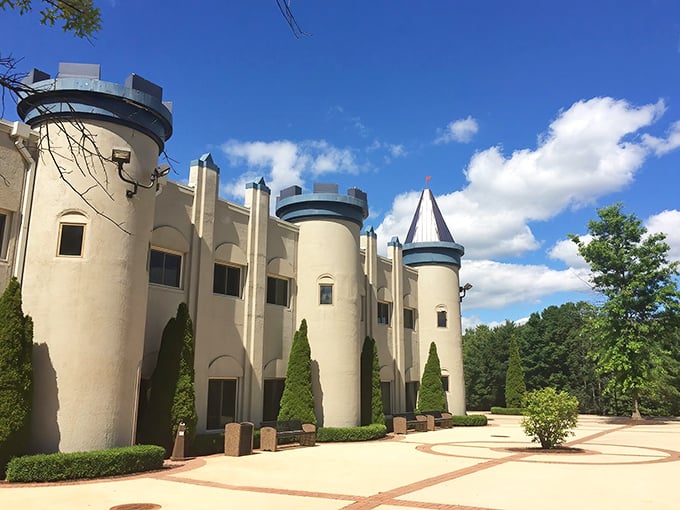 Cream-colored walls and blue-topped turrets create a fairy tale silhouette against Michigan's sky &ndash; medieval magic in America's heartland.
