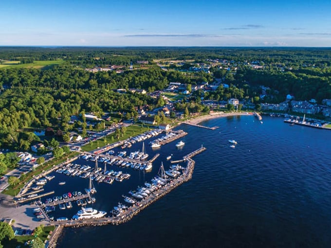 Fish Creek's harbor sparkles under blue skies, where boats bob gently and time seems to slow down perfectly.