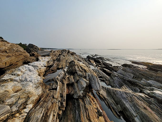 Nature's own architectural masterpiece: ancient metamorphic rock formations create a staircase fit for mythological beings along Maine's dramatic coastline.
