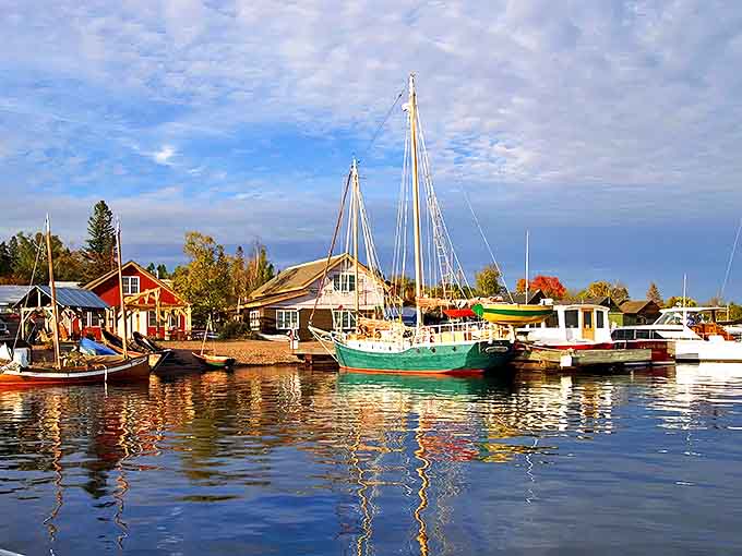 Where colorful boats bob gently against a backdrop of endless blue, creating a scene straight from a painter's dream.