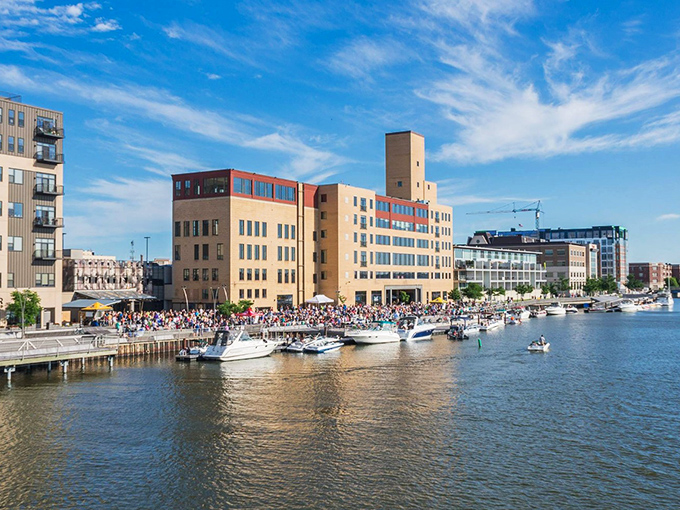 Green Bay's waterfront sparkles under blue skies, where boats bob gently and historic buildings frame a scene that rivals any coastal town &ndash; without the coastal prices.
