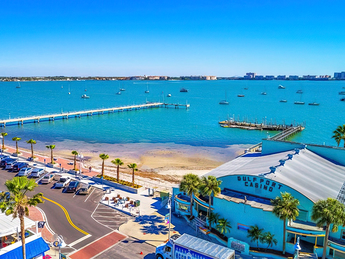 Gulfport's stunning waterfront vista showcases the vibrant blue waters of Boca Ciega Bay, where sailboats bob gently against a backdrop of Florida sunshine.
