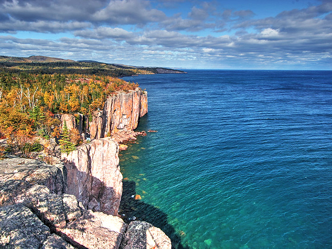 Highway 61's dramatic cliffs plunge into Lake Superior's azure waters, creating a coastline that rivals any ocean view in America.