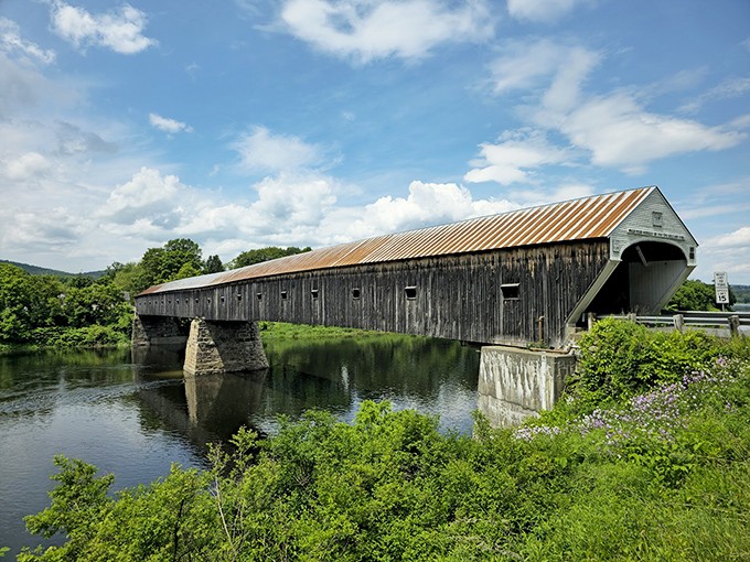 The Cornish-Windsor Covered Bridge stretches majestically across the Connecticut River, its weathered timbers telling stories of centuries past.