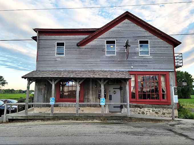 The Jail House stands proudly against Wisconsin's countryside, its weathered siding and red trim hinting at stories from another era.