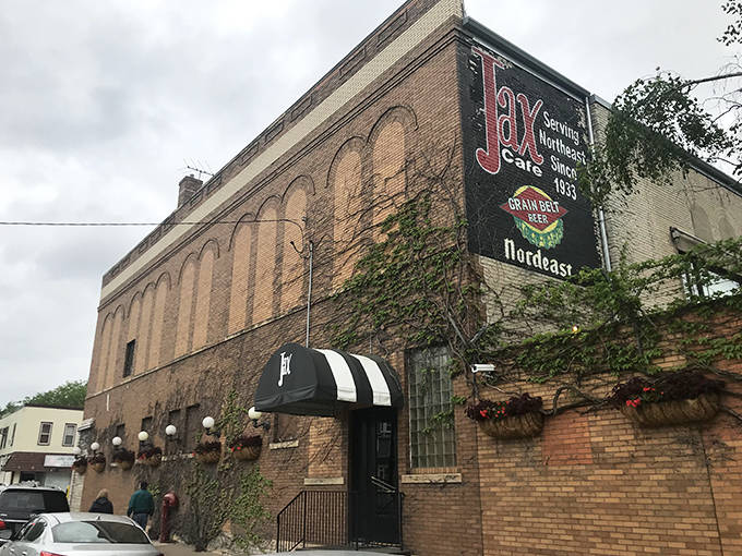 Exterior: The iconic brick facade of Jax Cafe stands proudly in Northeast Minneapolis, its vintage sign promising timeless dining experiences since 1933.