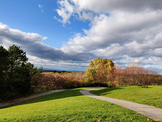 Overlook Park's rolling green hills and winding paths invite visitors to wander and wonder, nature's own welcome mat.