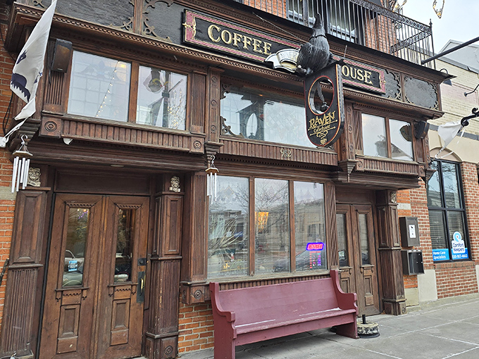 The Raven Caf&eacute;'s wooden fa&ccedil;ade whispers Victorian secrets, with ornate details and that iconic coffee house sign beckoning literary souls inside.