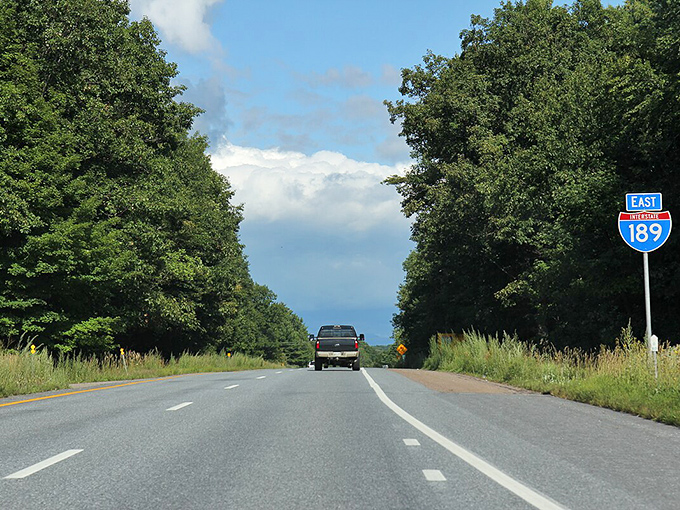 The open road stretches ahead like a promise, though this particular promise has been broken and left to contemplate its life choices.