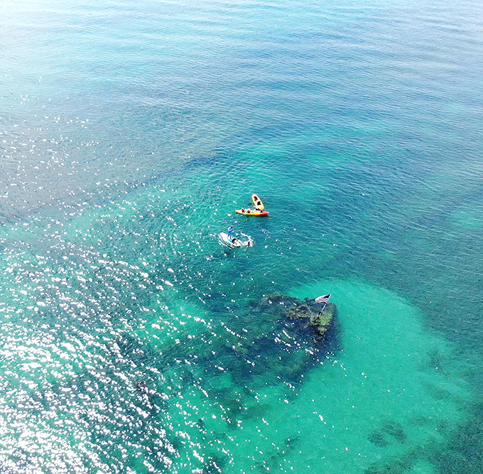 The SS Breconshire rests in crystal-clear waters, a Victorian time capsule transformed into nature's playground. History never looked so refreshingly accessible!