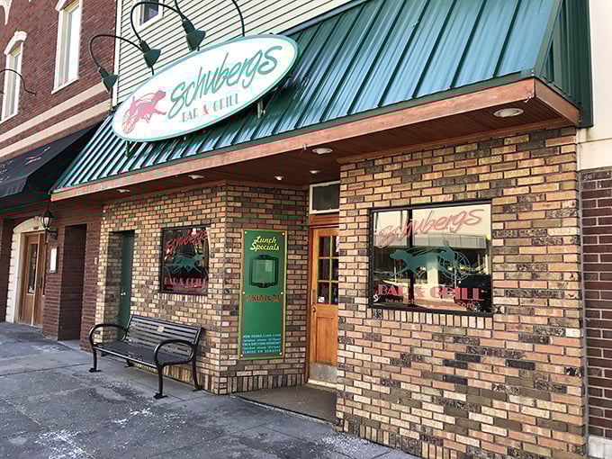 Schuberg's iconic storefront beckons hungry travelers with its vintage brick facade and distinctive oval sign, promising comfort food that transcends time.