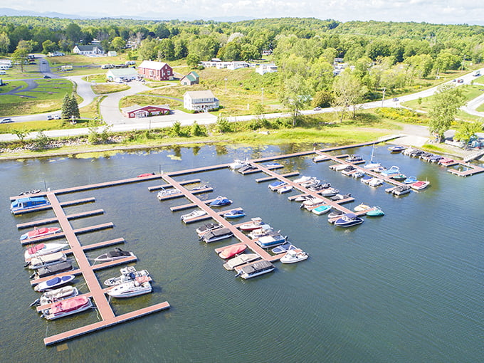 Aerial view of South Hero's marina, where boats bob like colorful toys in a bathtub and the landscape unfolds like nature's welcome mat.