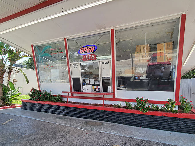 The unassuming exterior of Strawberry Hut belies the culinary treasures within. This modest walk-up window has been serving Plant City's best sandwiches for decades.