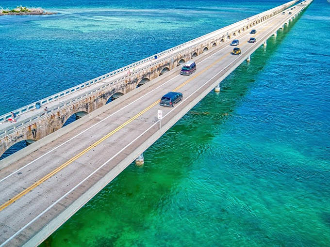 The iconic Seven Mile Bridge stretches across impossibly blue waters, a thin line between reality and paradise on State Road A1A.
