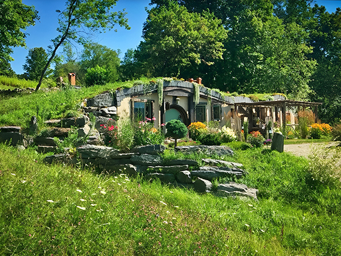 A hillside dream come to life: Vermont's hobbit house emerges from the landscape with its grass-covered roof and charming round entrance.