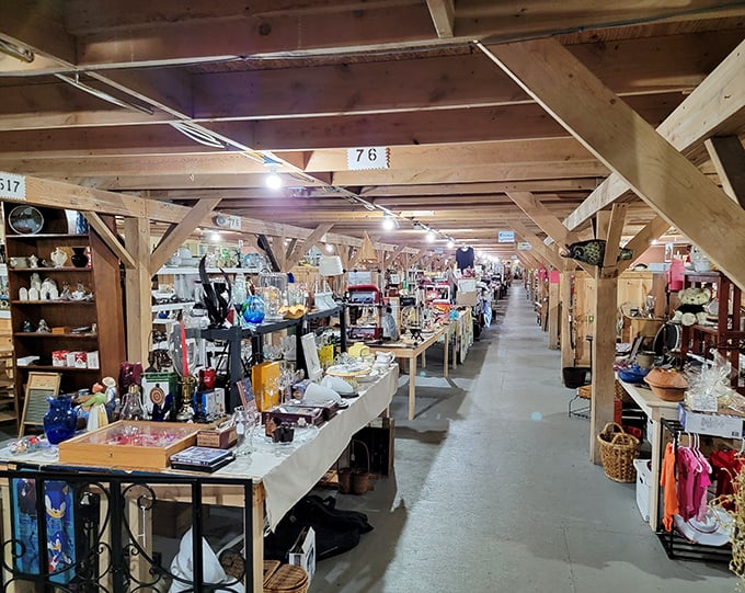 Long wooden corridors lined with treasures &ndash; The Willows Flea Market's main floor stretches seemingly to infinity, a wonderland of possibilities waiting to be discovered.