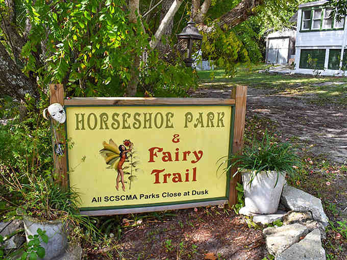 Welcome to whimsy! The charming entrance sign to Horseshoe Park and Fairy Trail invites visitors into a world where imagination reigns supreme.