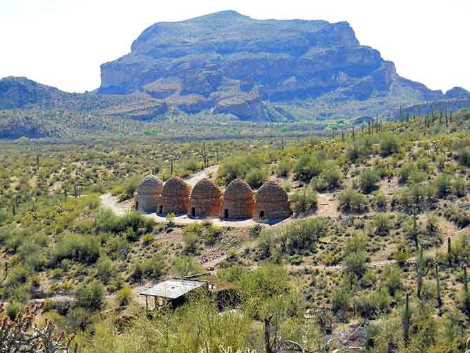 Five stone beehives rise from the desert floor like ancient monuments, proving that Arizona's most interesting architecture doesn't always come with a gift shop.