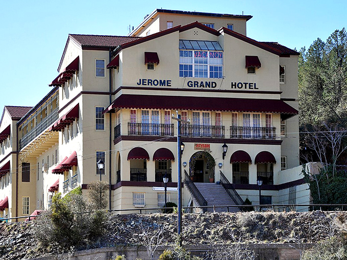 The Jerome Grand Hotel stands majestically against the Arizona sky, its Spanish Mission architecture hinting at stories both historical and supernatural within its walls.