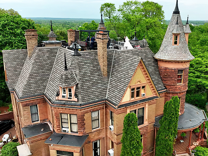 Henderson Castle stands majestically against the Michigan sky, its turrets and red sandstone exterior promising a dining adventure fit for royalty.