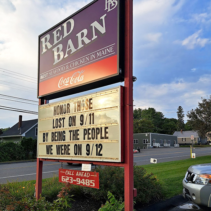 The iconic Red Barn sign stands tall along Riverside Drive, promising seafood treasures and wisdom in equal measure. Maine's culinary lighthouse beckons!