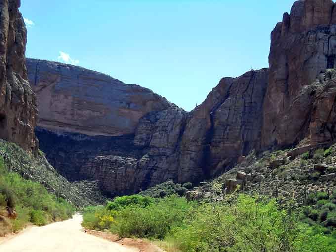 Roosevelt Dam rises from the desert like a concrete monument to human ambition meeting natural forces in spectacular fashion.