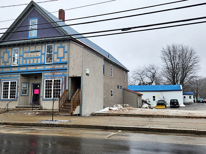The historic K of P Hall building houses Katherine's Bakery & Cafe, where the bright blue trim and welcoming steps promise sweet adventures within.