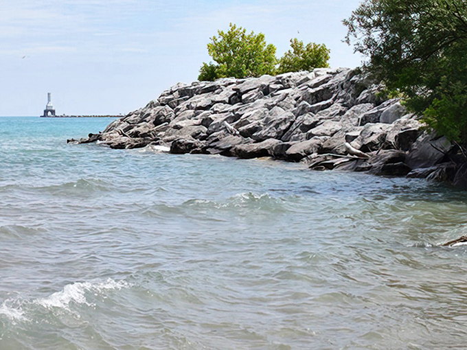Lake Michigan's rocky shoreline creates nature's perfect meditation spot, where water meets stone in a timeless dance of elements.