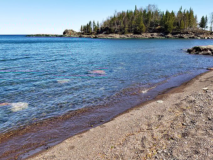 The welcoming log cabin of Sugarloaf Nature Center stands like a friendly sentinel, inviting curious souls to discover what lies beyond its rustic doors.