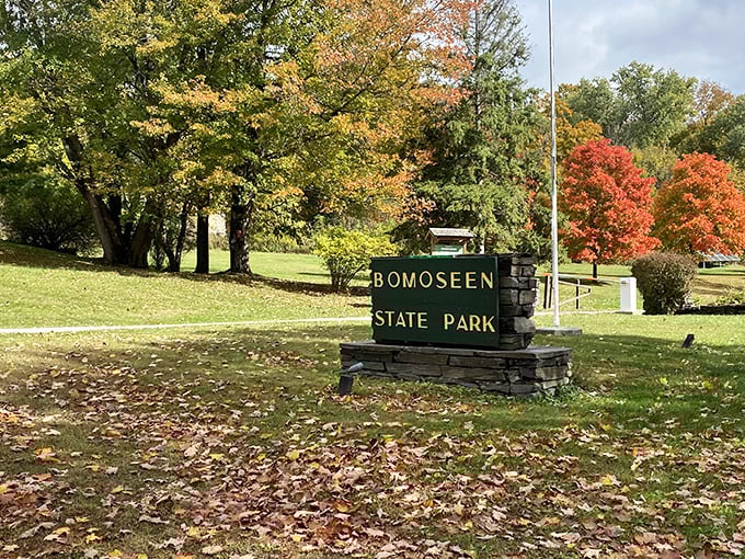 Welcome to Bomoseen State Park, where autumn paints the entrance with Vermont's signature golden hues and fiery maples.